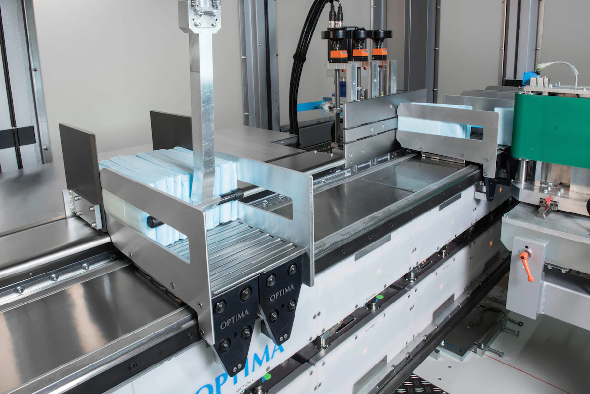 Optima Packaging Group: Stacker | Healthcare Packaging
